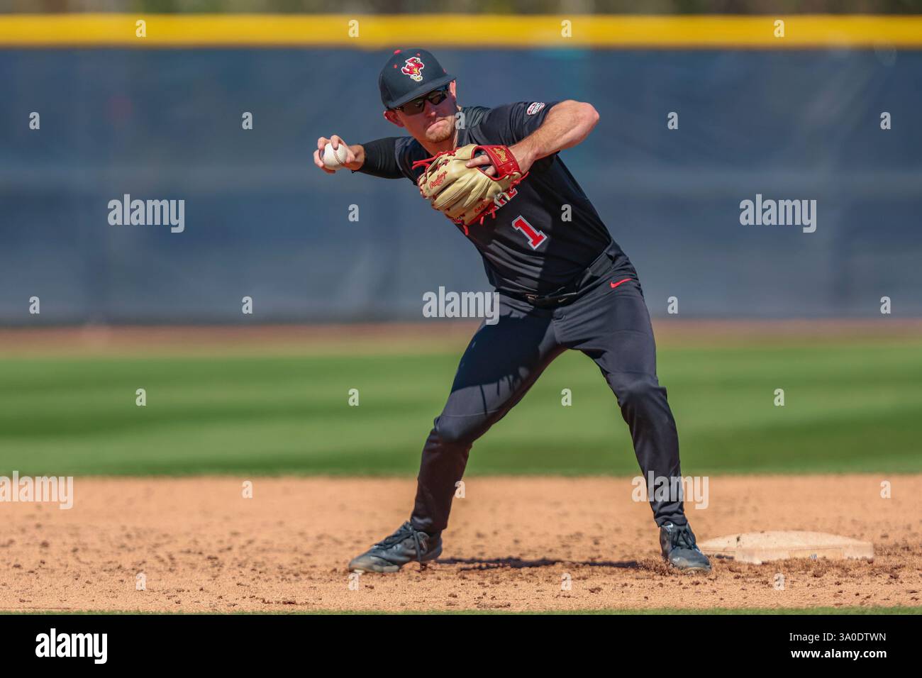 Ball State utility Grant Miller (1) warms up before an NCAA baseball ...