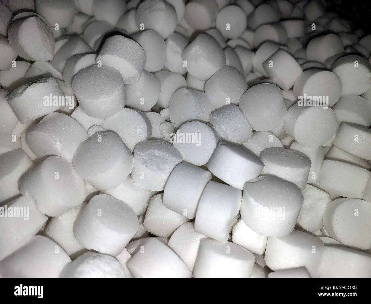 White tablet salt pieces are piled high, showcasing a captivating ...