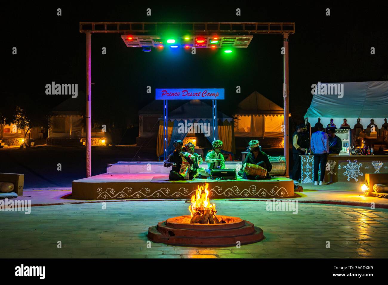 Traditional folk music played at a desert camp in the evening to ...