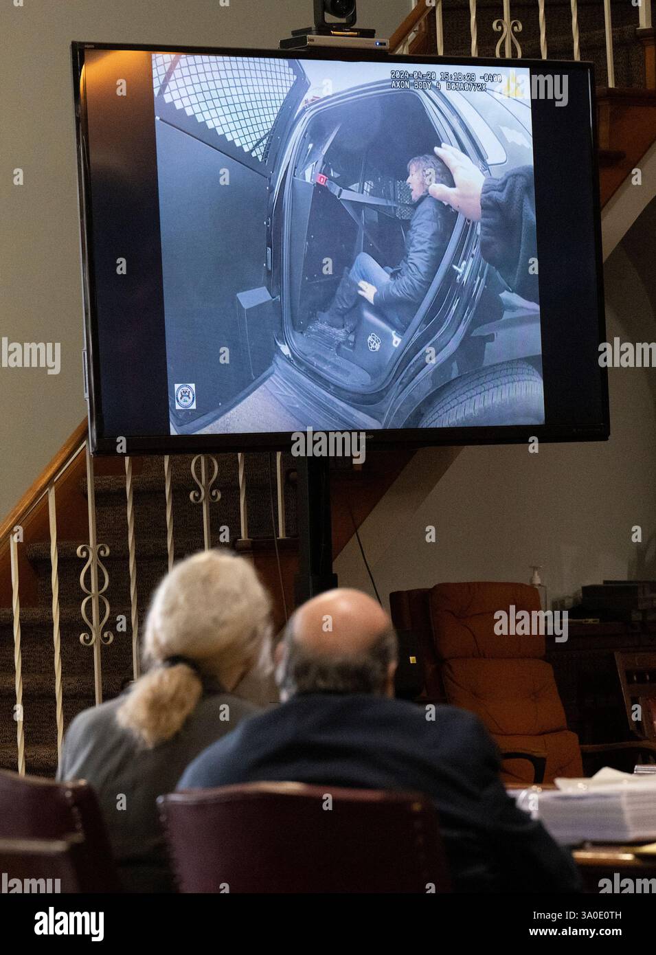 Marcella Chidester sits with her attorney Bill Colovos as they watch ...