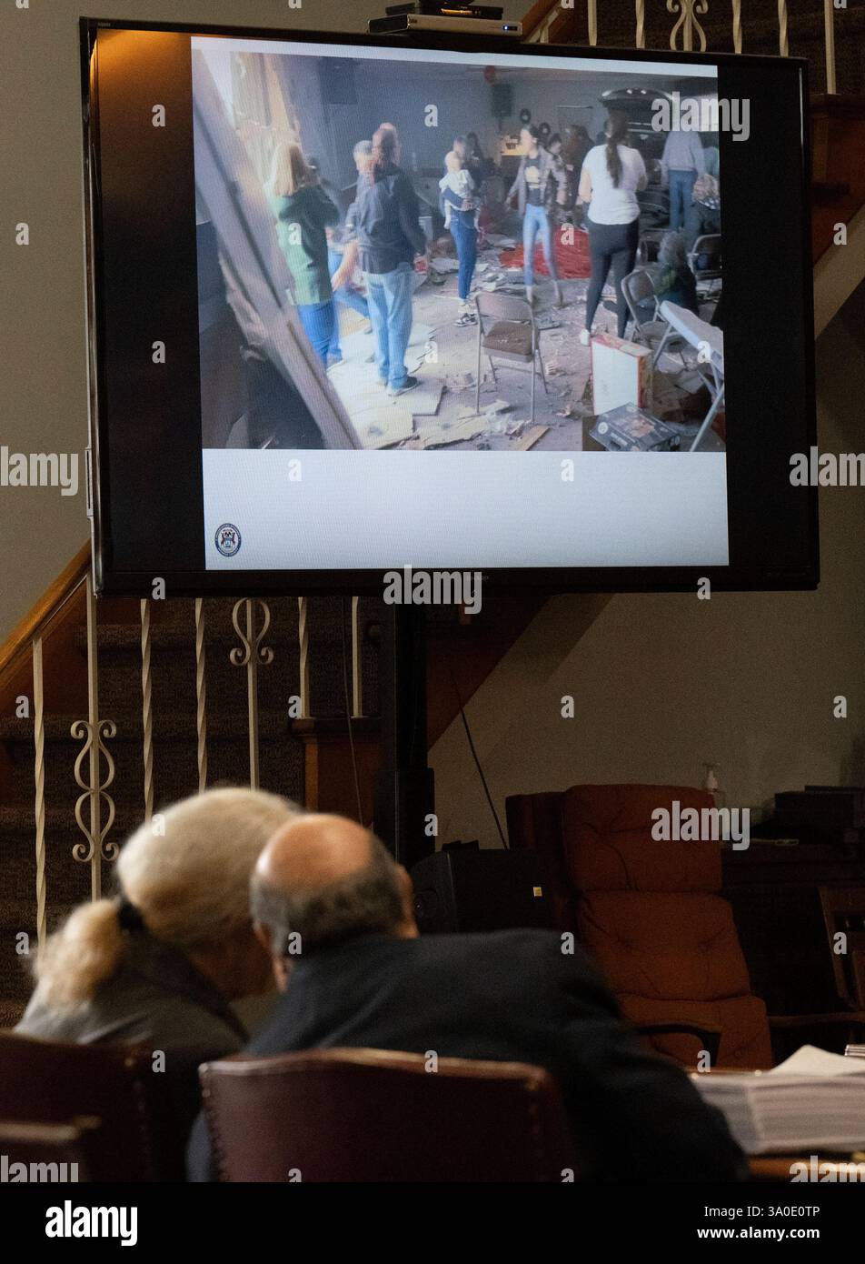 Marcella Chidester speaks to her attorney Bill Colovos as cell phone ...