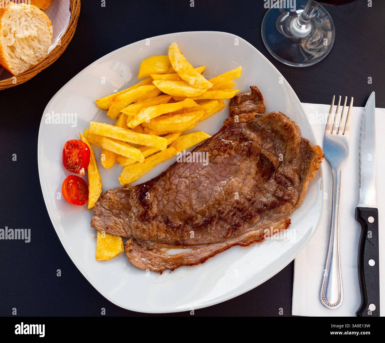 Deep-fried beef chop with French fries, served with red wine Stock ...