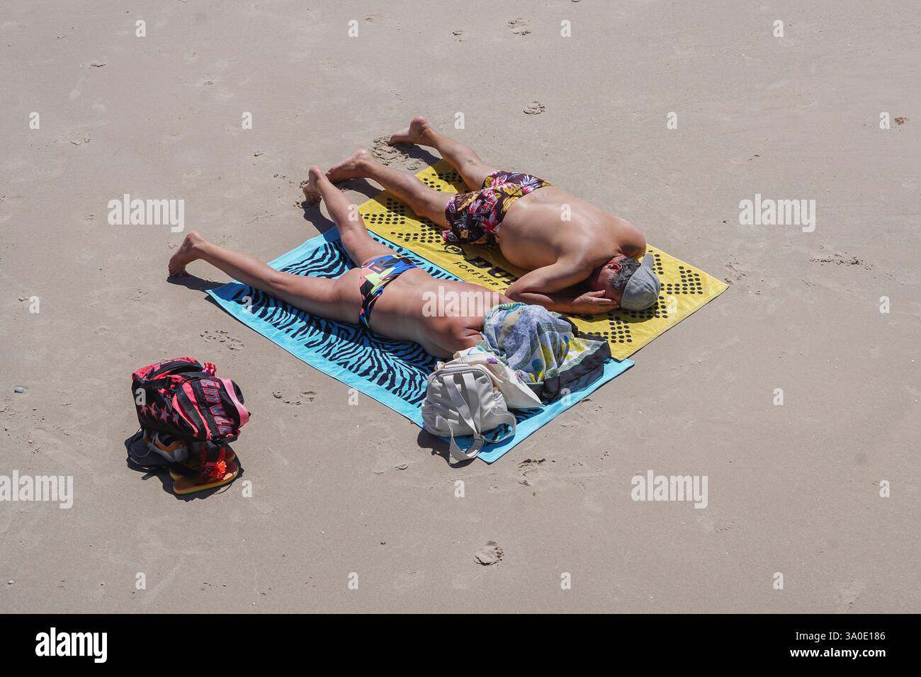 Adelaide, Australia 3 March 2025. Beachgoers sunbathing at Henley beach ...