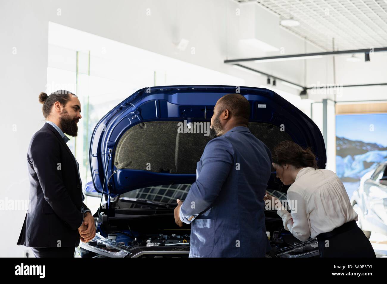 Dealership sales executive providing in depth knowledge about vehicle ...