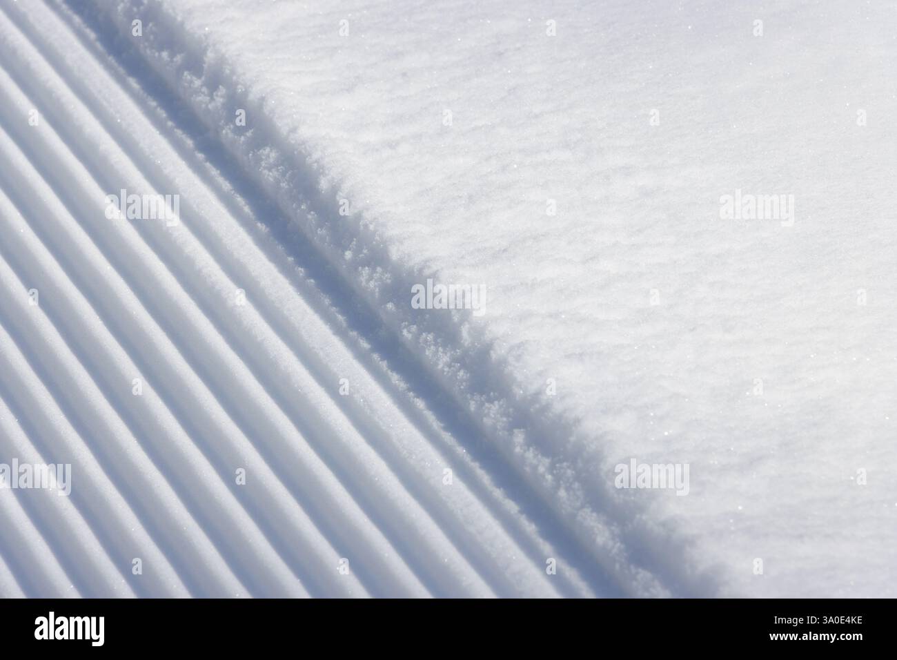 Diagonal line in flat white snow surface textured background on ski ...