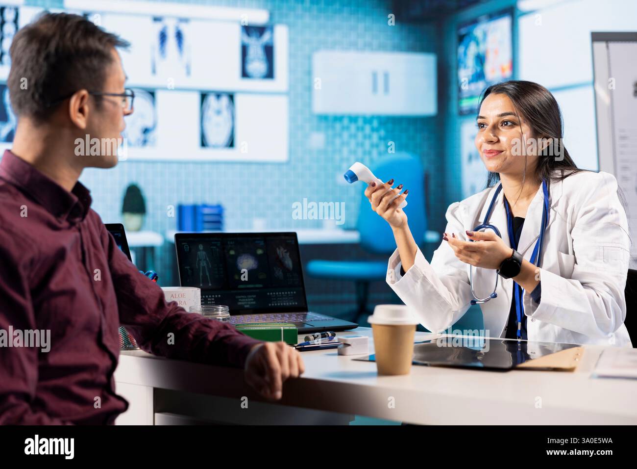 Medical specialist using thermometer to check fever measurements ...