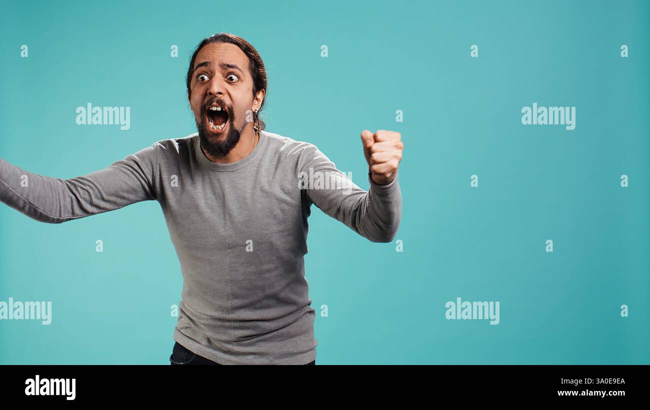 Portrait of irate man feeling outraged, yelling at friend, releasing ...