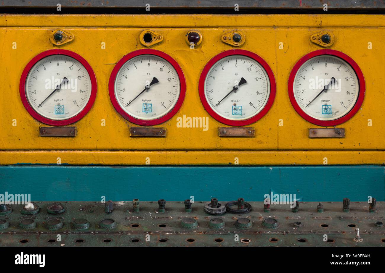 A row of industrial pressure gauges on a panel. Manometers Stock Photo ...