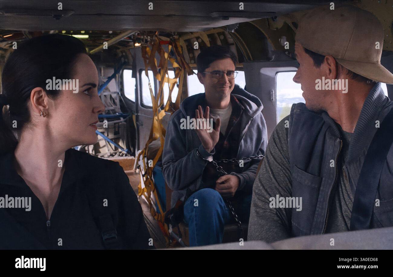 FLIGHT RISK, from left: Michelle Dockery, Topher Grace, Mark Wahlberg, 2025. © Lionsgate Films ...