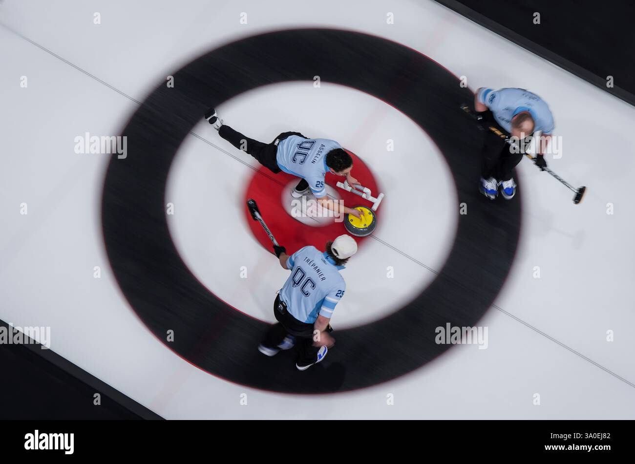 Quebec skip Felix Asselin, top left, delivers a rock as lead Jean ...