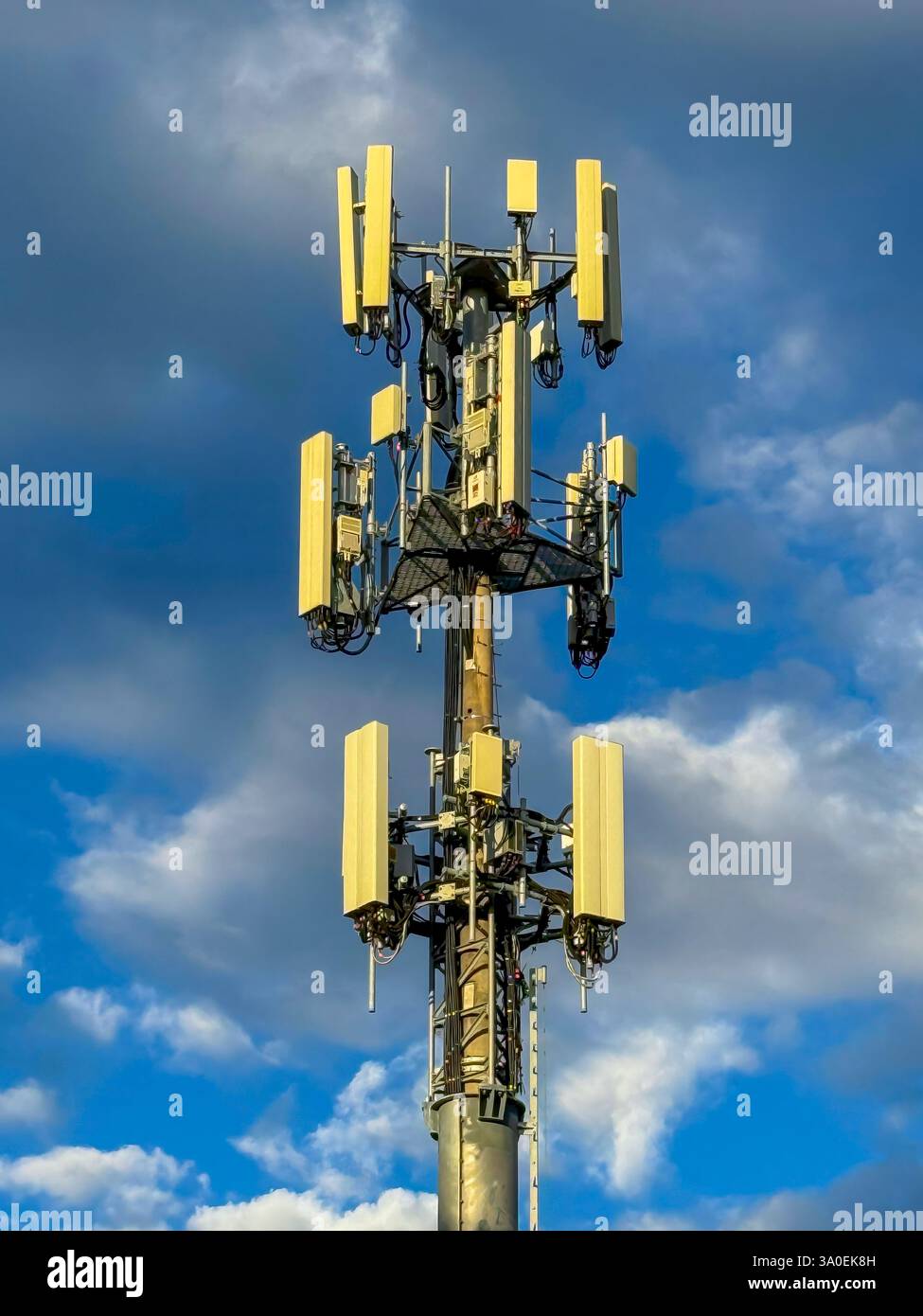 Photograph of the antenna array of a large Telecommunications Tower providing communications ...