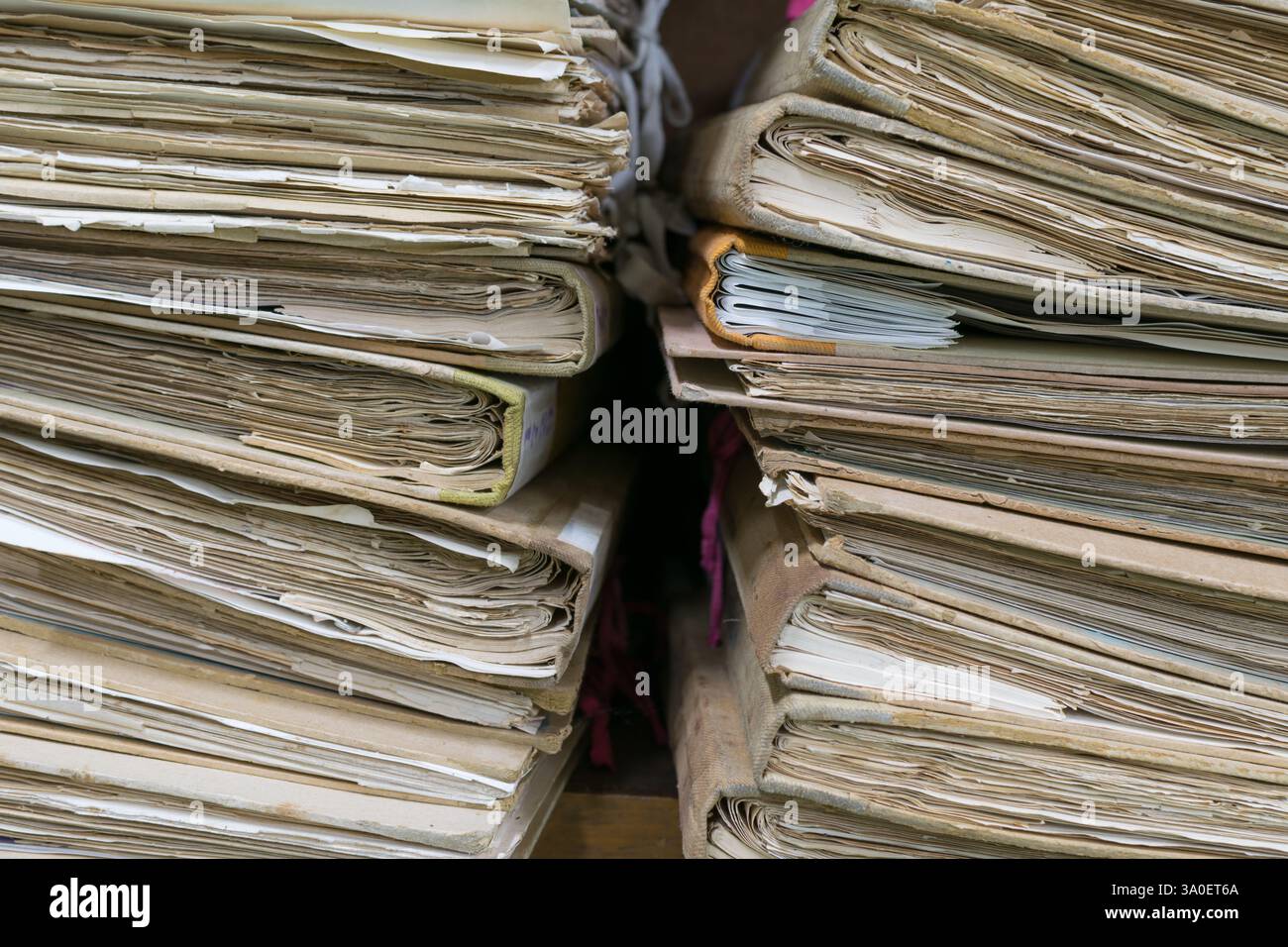 Old files in old folder stacking up in a messy order Stock Photo - Alamy