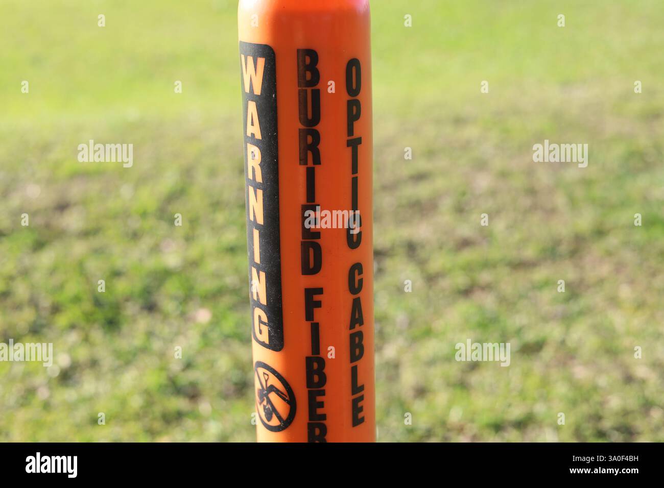 Fiber optic buried cable warning post Stock Photo - Alamy