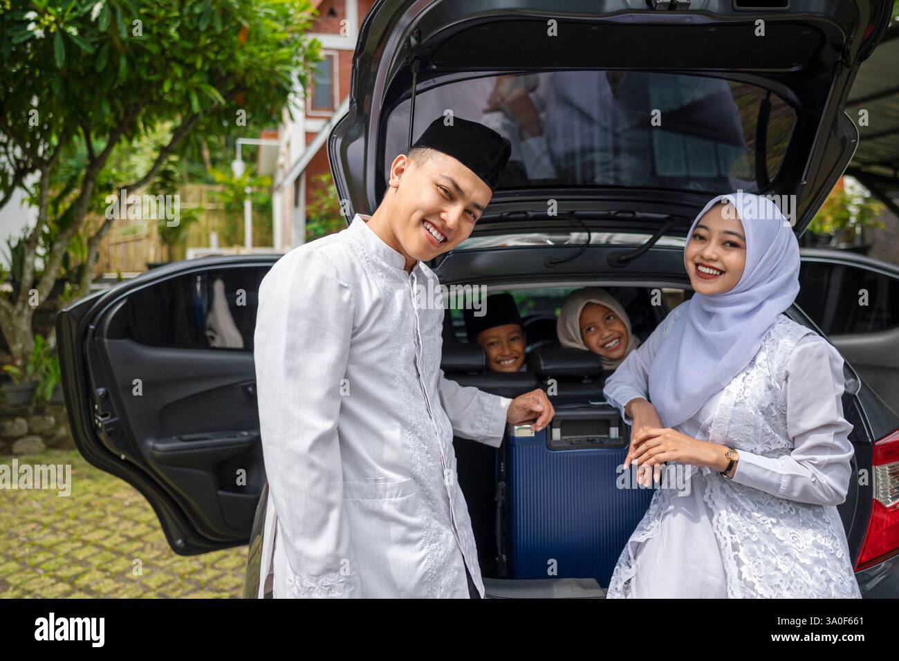 Asian Muslim family ready to mudik or travel to hometown by car ...