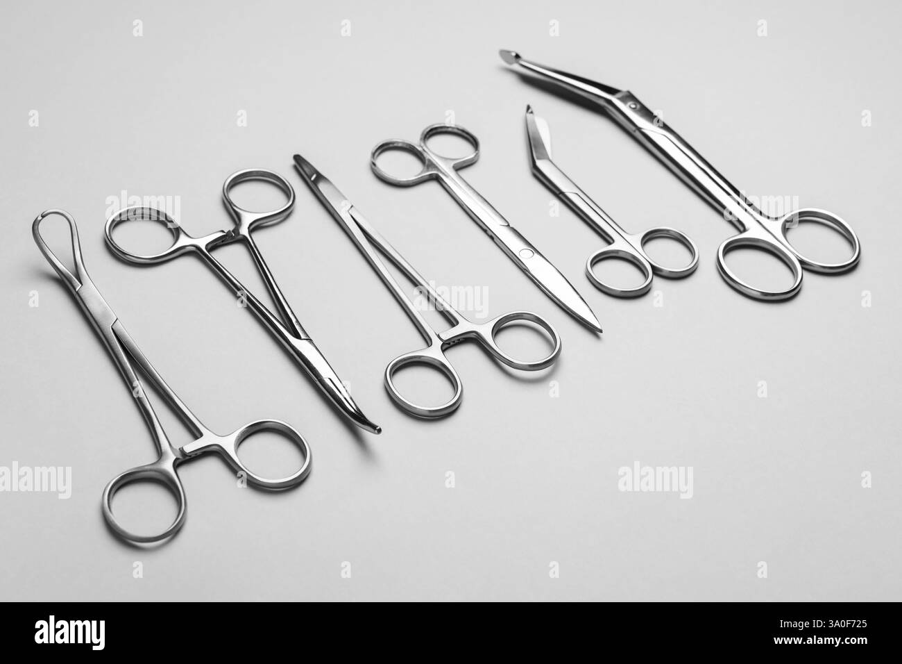 Different surgical instruments on grey background, closeup Stock Photo ...