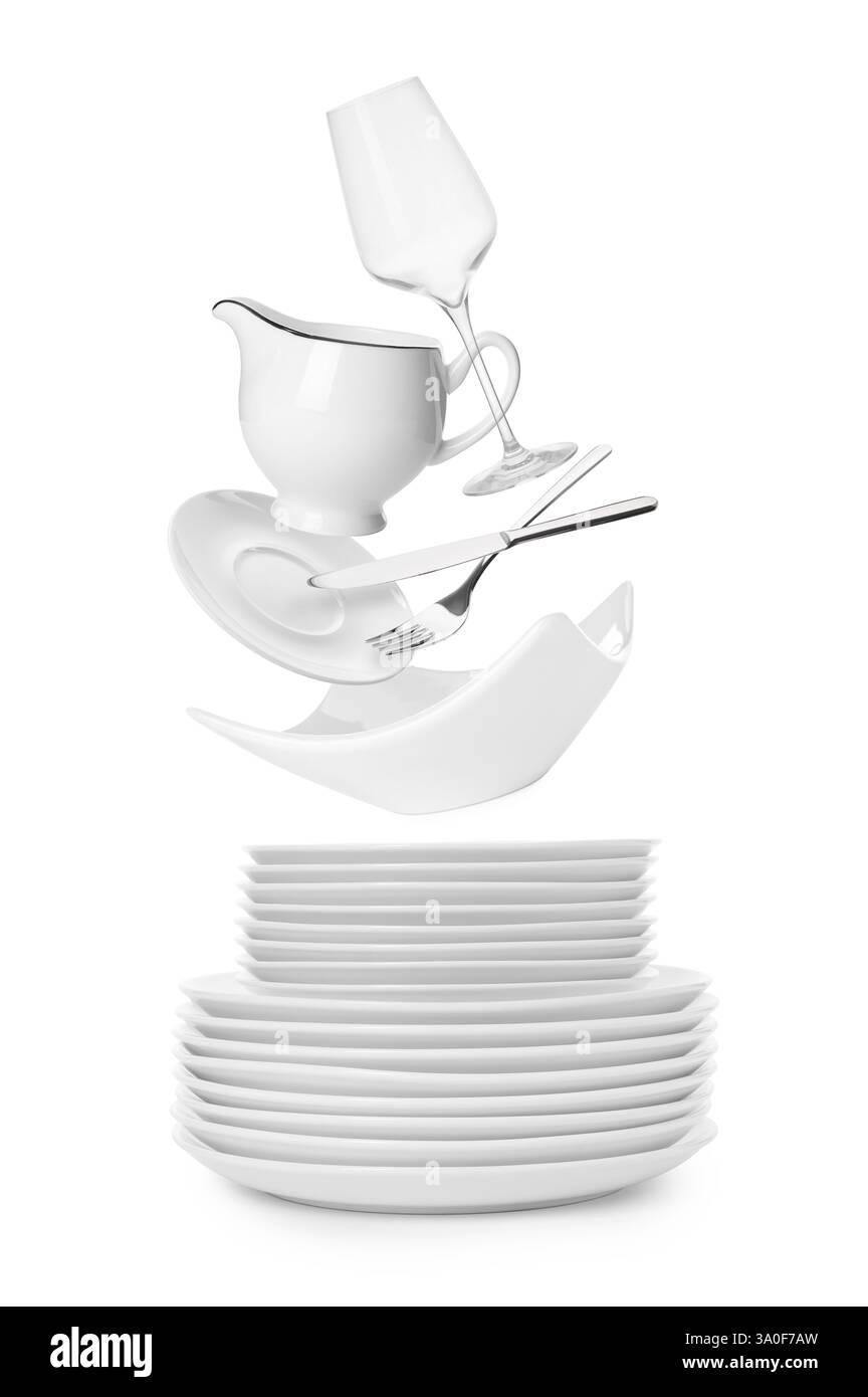 Clean dishware, glass and silverware flying over plates on white ...
