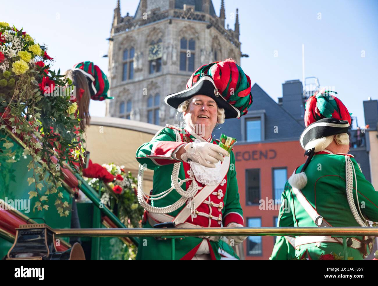 (250304) -- COLOGNE, March 4, 2025 (Xinhua) -- A reveler casts candies ...