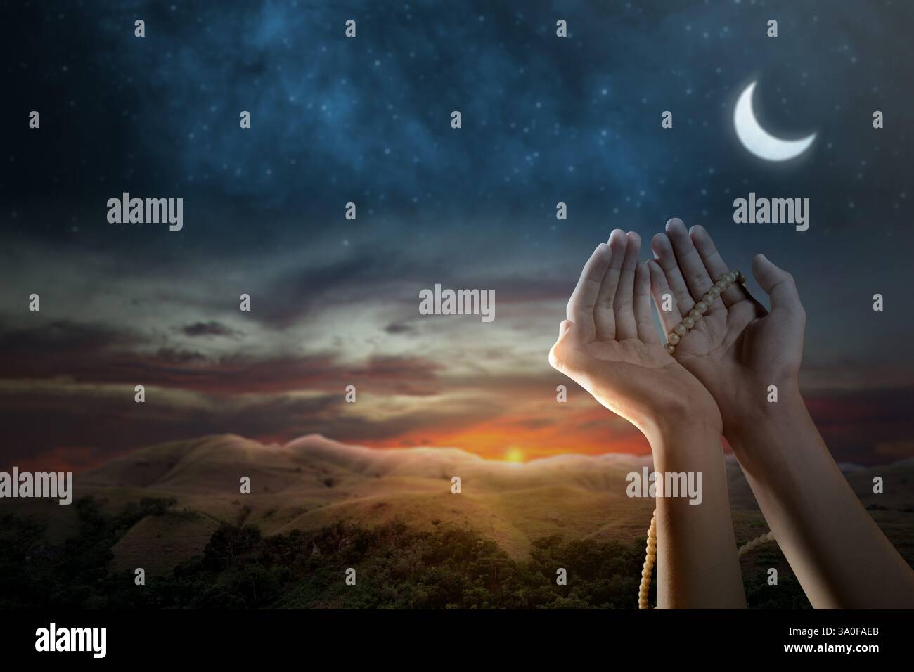 Muslim man praying with prayer beads and a crescent moon in the night ...