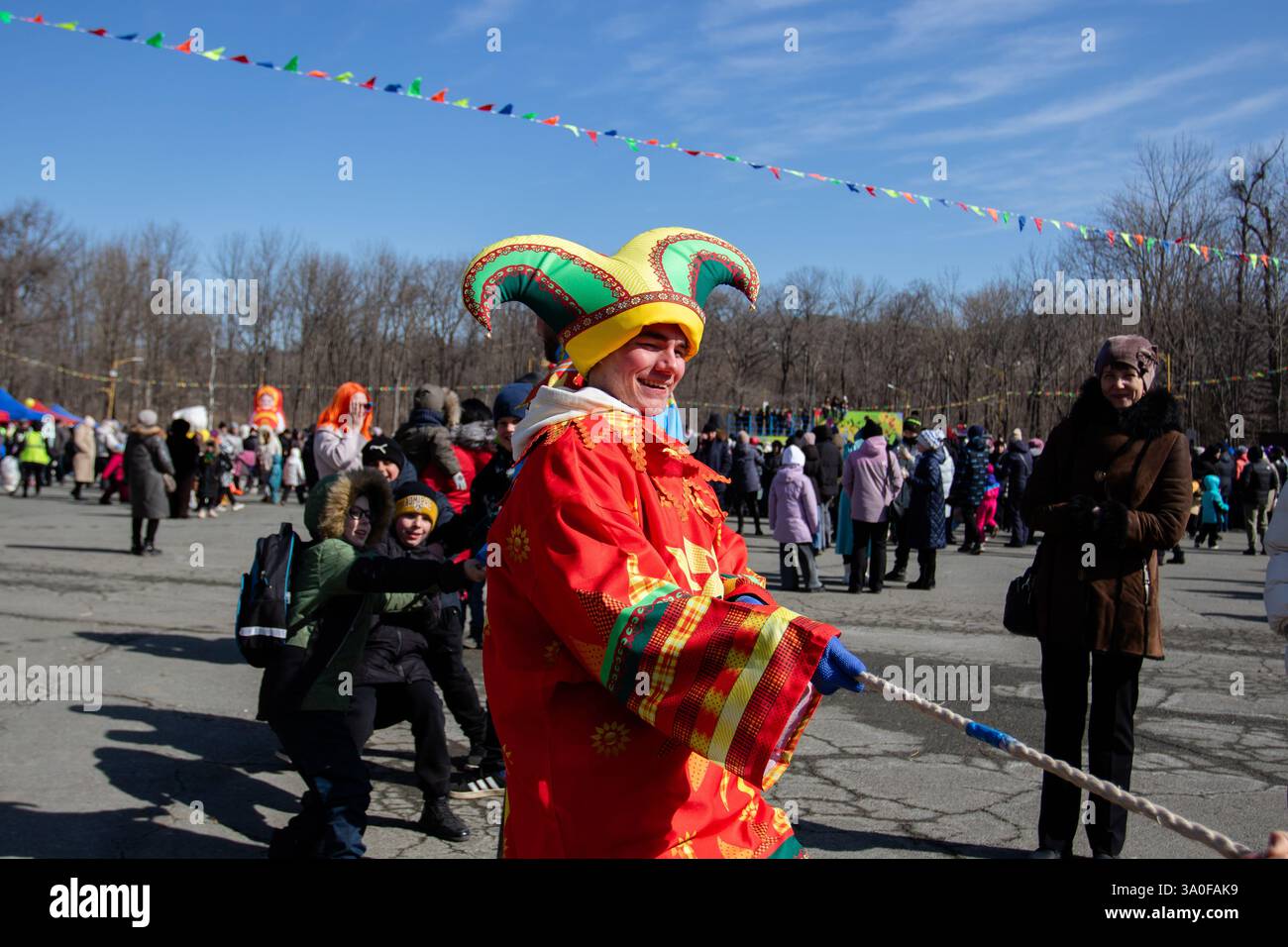 Artem, Russia. 02nd Mar, 2025. A man dressed in a buffoonery costume in ...