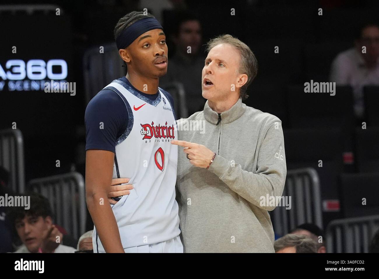 Washington Wizards head coach Brian Keefe talks to guard Bilal ...