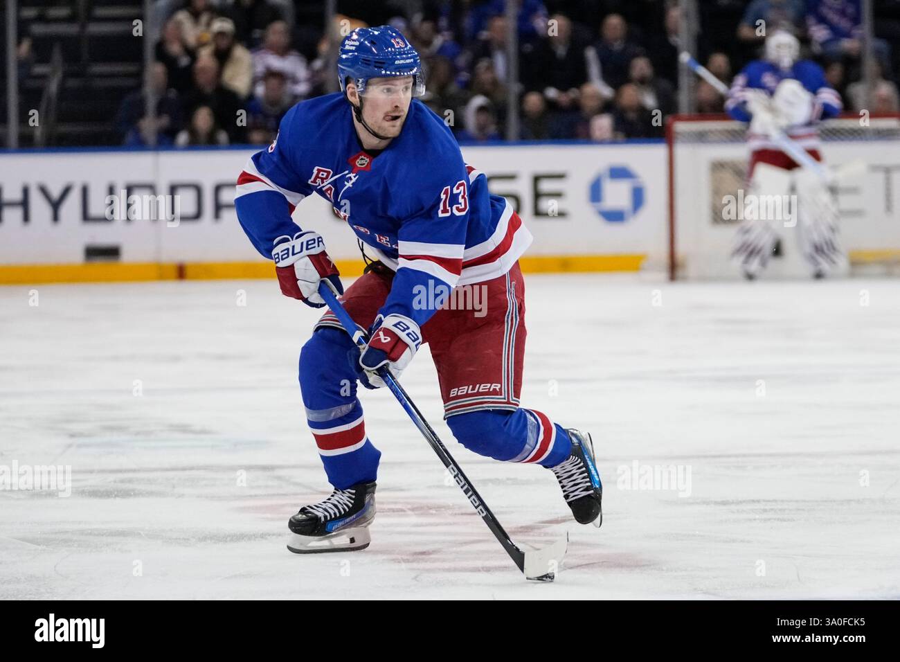 New York Rangers' Alexis Lafrenière (13) looks to pass during the ...