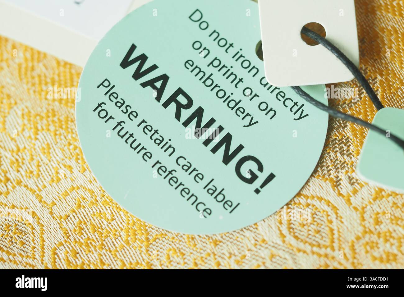 Warning label providing care instructions for clothing Stock Photo - Alamy