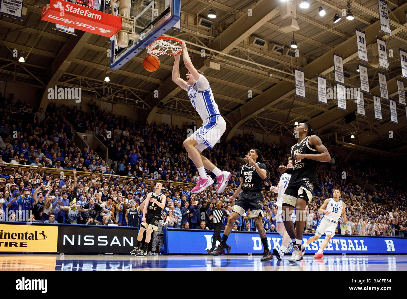 Duke's Cooper Flagg (2) dunks during the second half of an NCAA college basketball game against ...