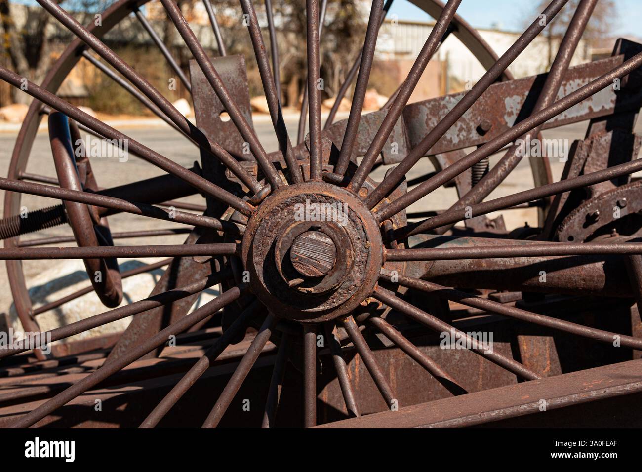 Abstract pattern made by the rusted steel spokes on wheels of an old ...