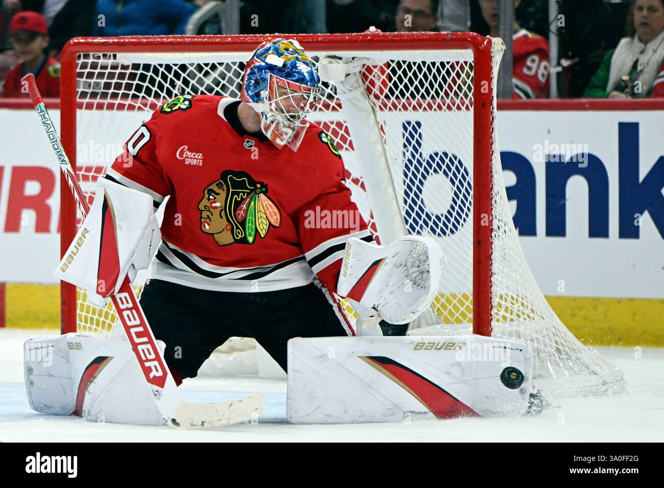 Chicago Blackhawks goalie Spencer Knight makes a save during the first ...