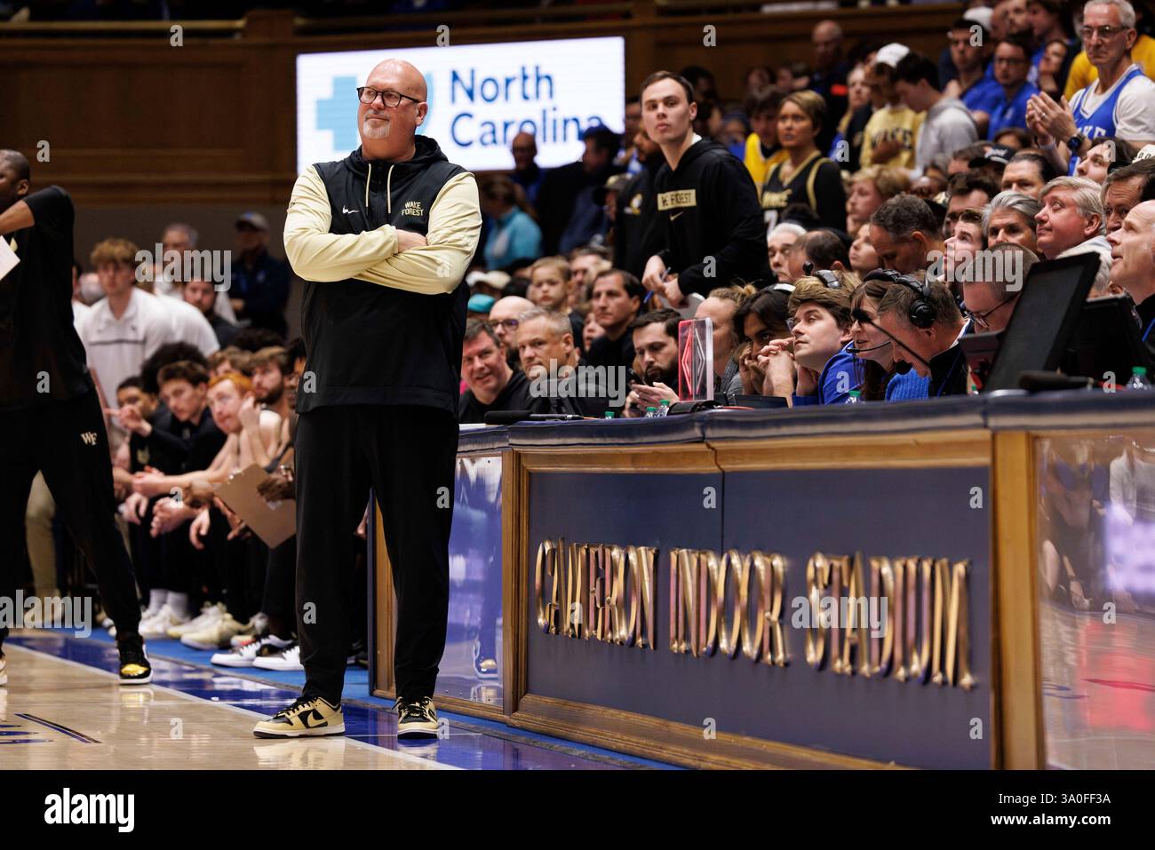 Wake Forest head coach Steve Forbes, front lrft, looks toward the court ...
