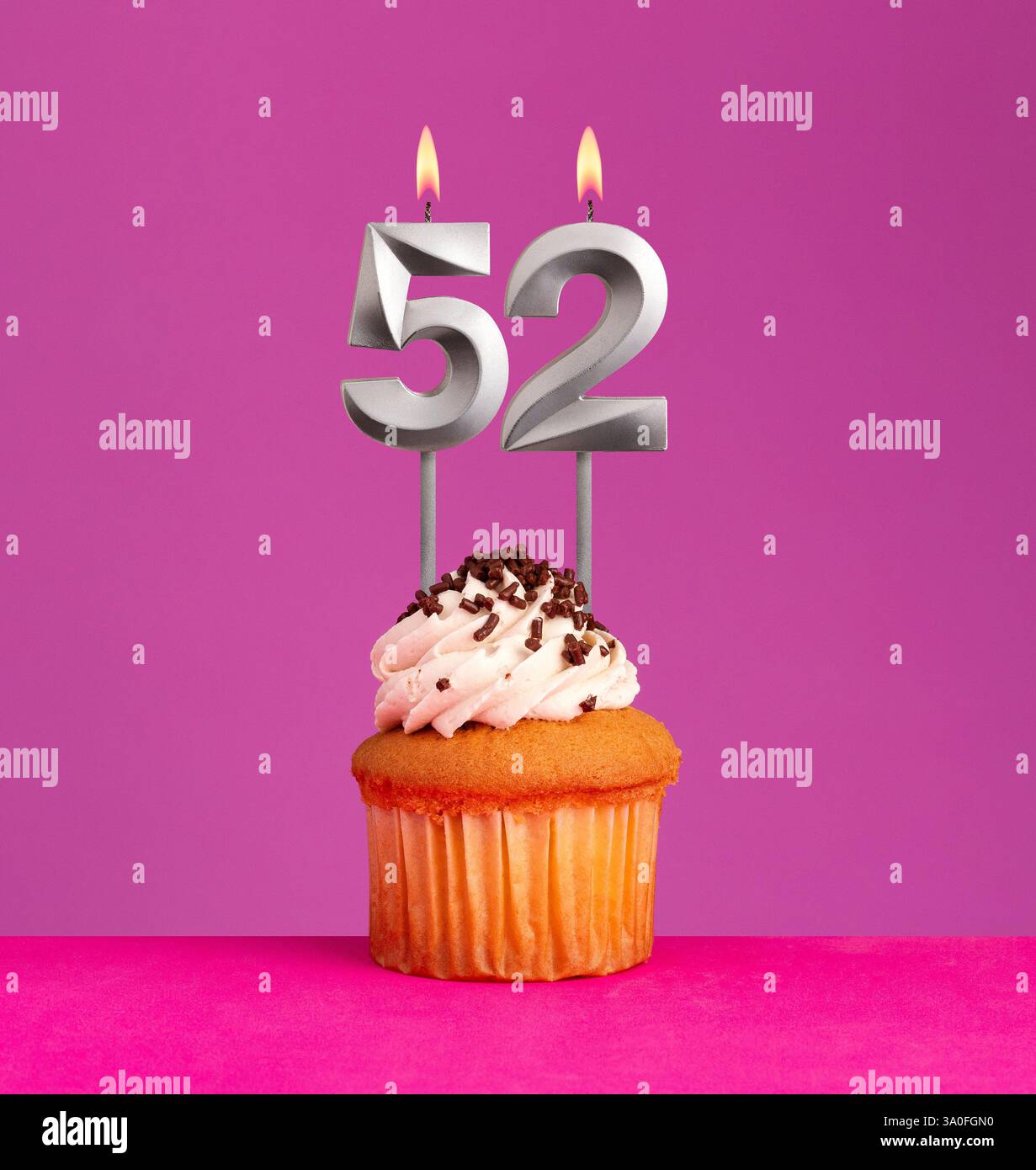 Birthday card on violet background - Candle number 52 Stock Photo - Alamy