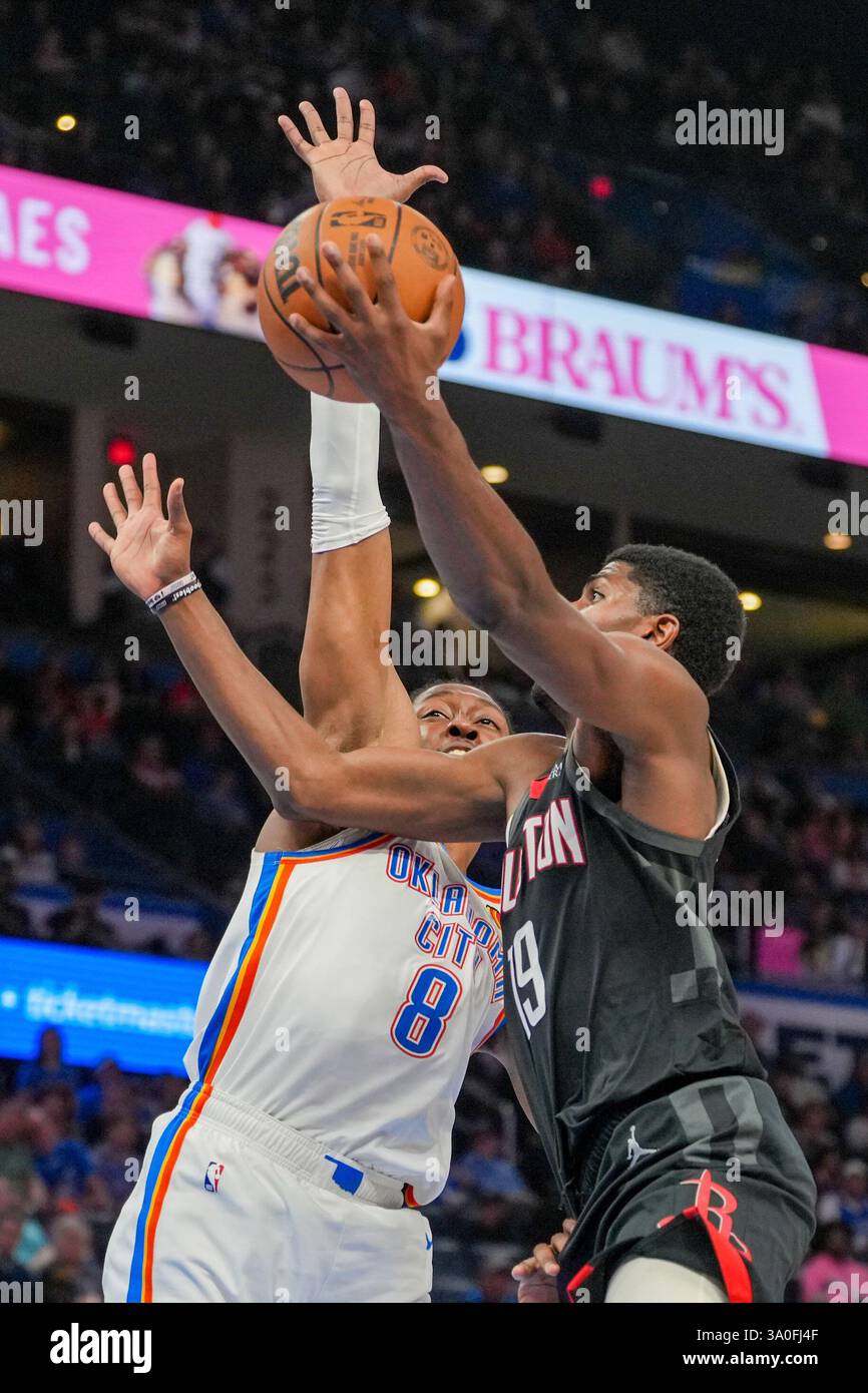 Houston Rockets guard Nate Williams, right, shoots over Oklahoma City ...