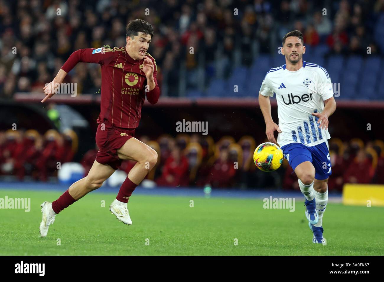 Rome, Italy. 02nd Mar, 2025. Eldor Shomurodov of Roma and Edoardo Goldaniga of Como seen in ...
