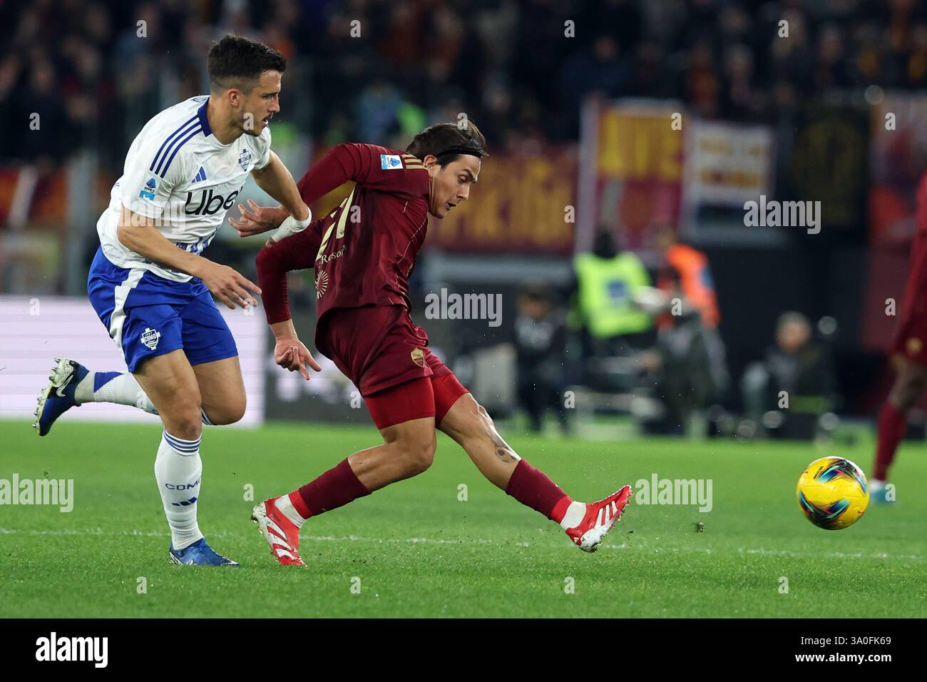 Rome, Italy. 02nd Mar, 2025. Marc Oliver Kempf of Como and Paulo Dybala of Roma seen in action ...
