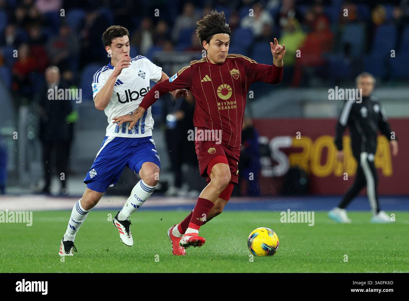 Maxime Perrone of Como and Paulo Dybala of Roma seen in action during ...