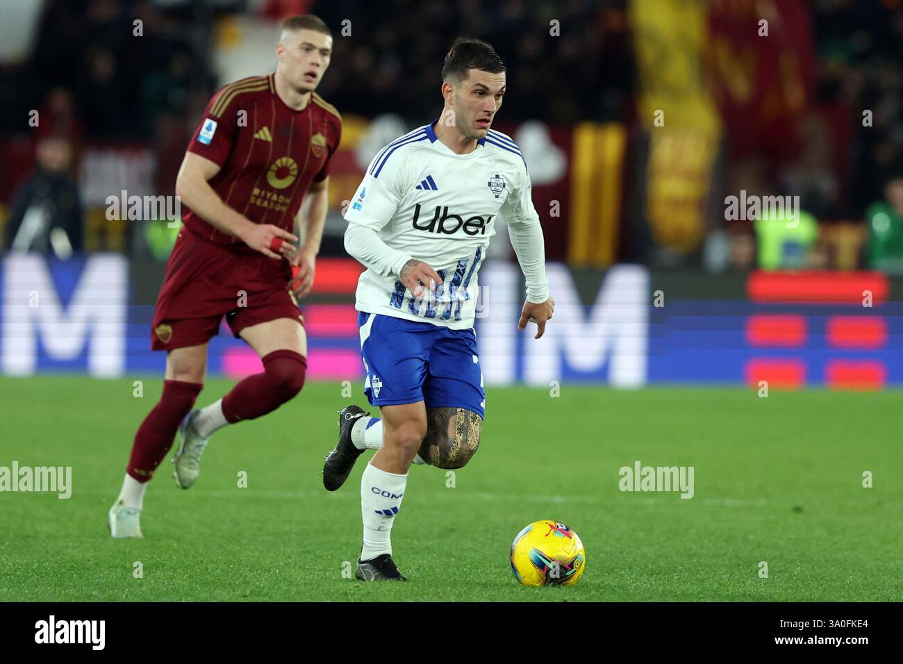 Rome, Italy. 02nd Mar, 2025. Artem Dovbyk of Roma and Gabriel Strefezza of Como seen in action ...