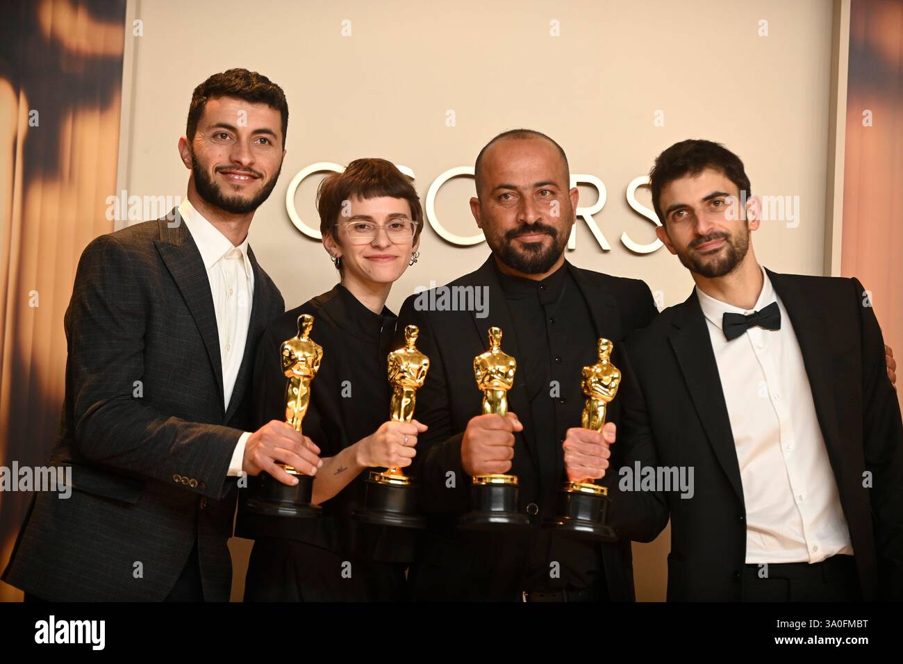 Hollywood, Ca. 2nd Mar, 2025. Basel Adra, Rachel Szor, Hamdan Ballal ...