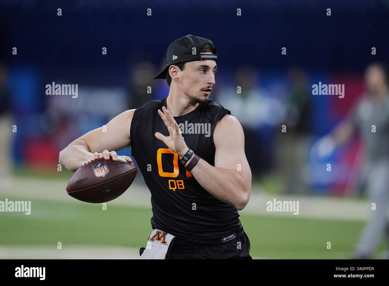Minnesota quarterback Max Brosmer runs a drill at the NFL football ...