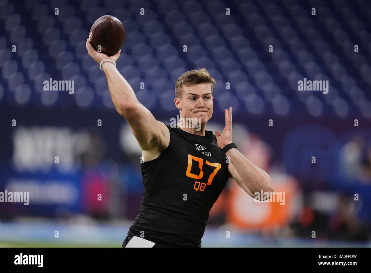 Ohio State quarterback Will Howard runs a drill at the NFL football ...
