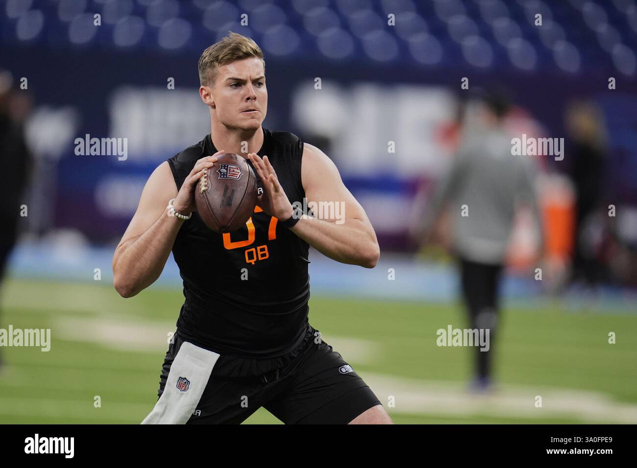 Ohio State quarterback Will Howard runs a drill at the NFL football ...
