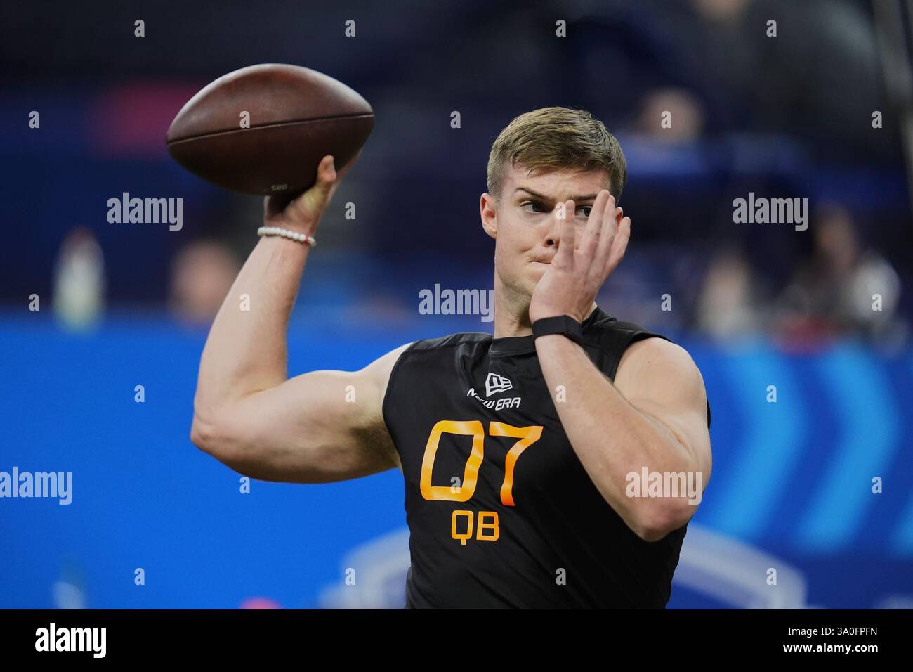 Ohio State quarterback Will Howard runs a drill at the NFL football ...
