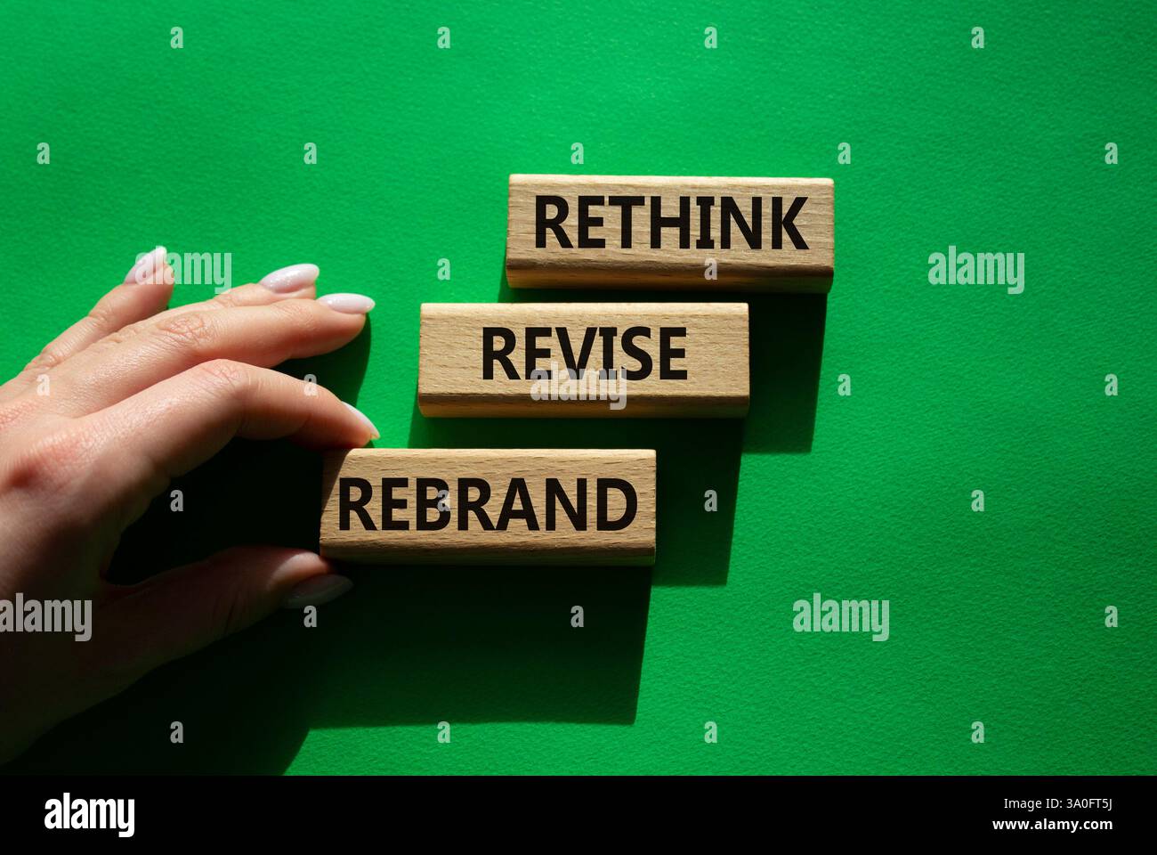 Rethink Revise Rebrand symbol. Wooden blocks with words Rethink Revise ...