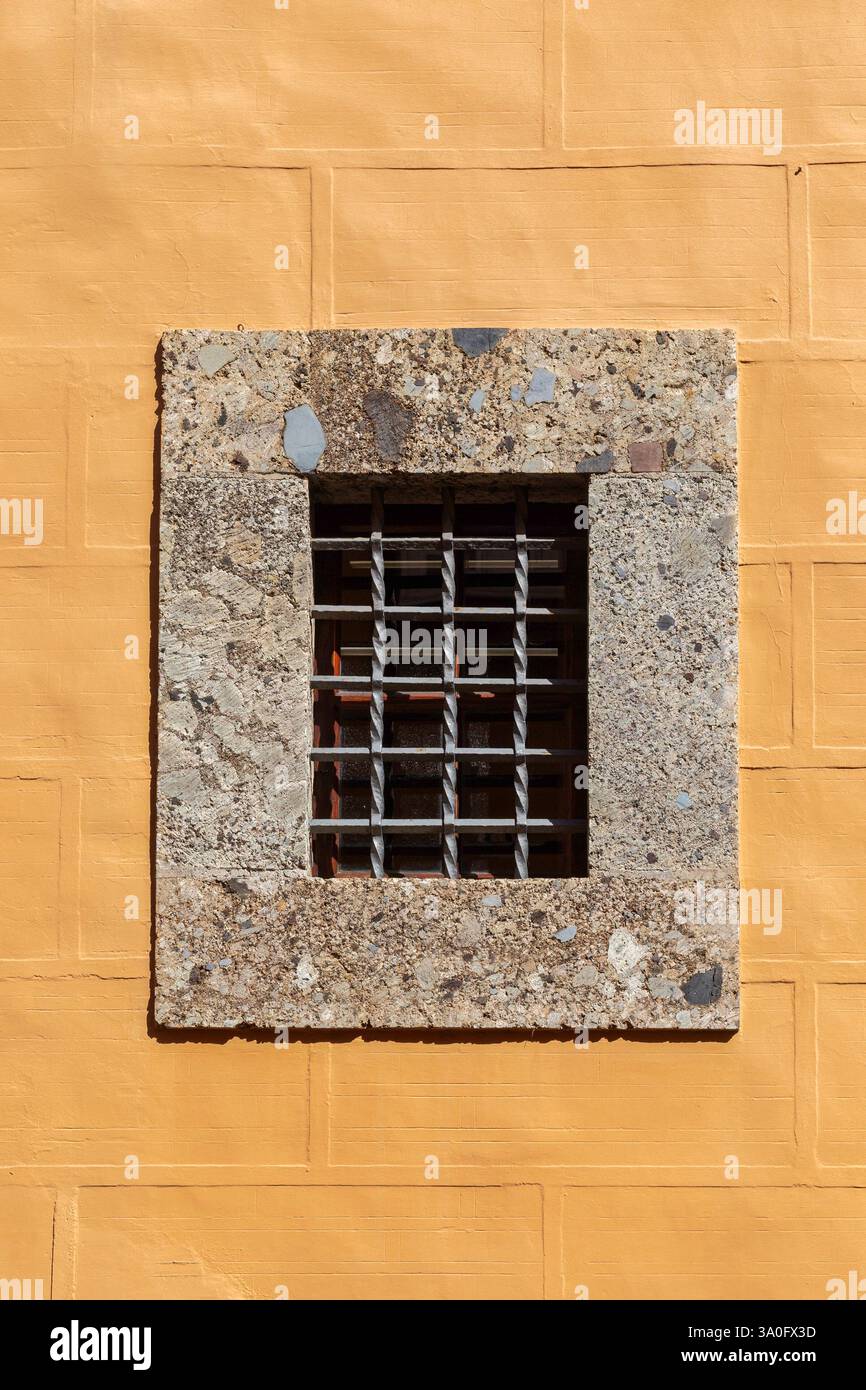 Barred square window in wall for use as a background Stock Photo - Alamy