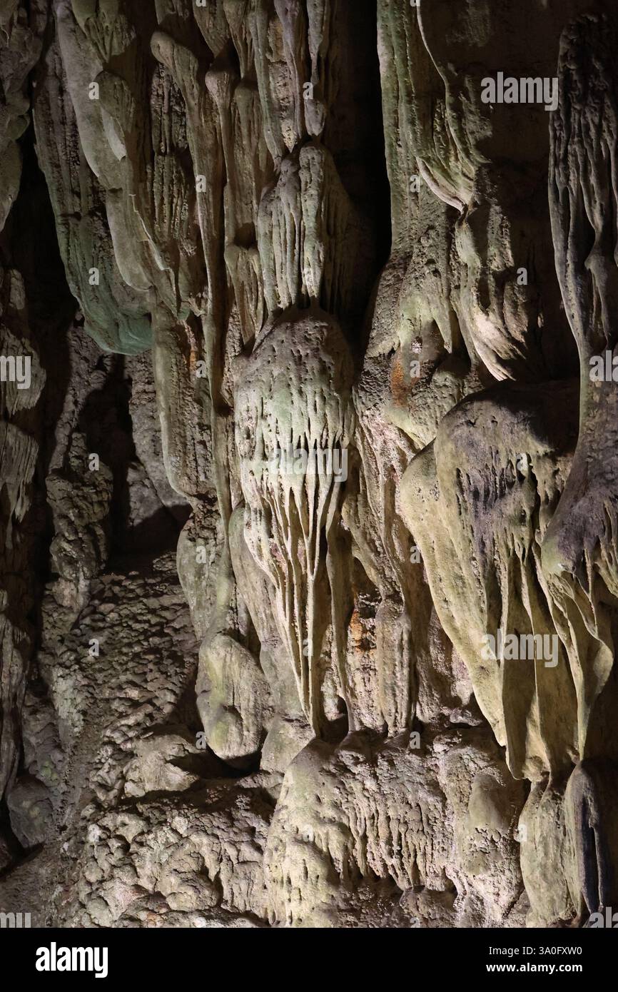 Caves on Islands in Ha Long Bay Stock Photo - Alamy