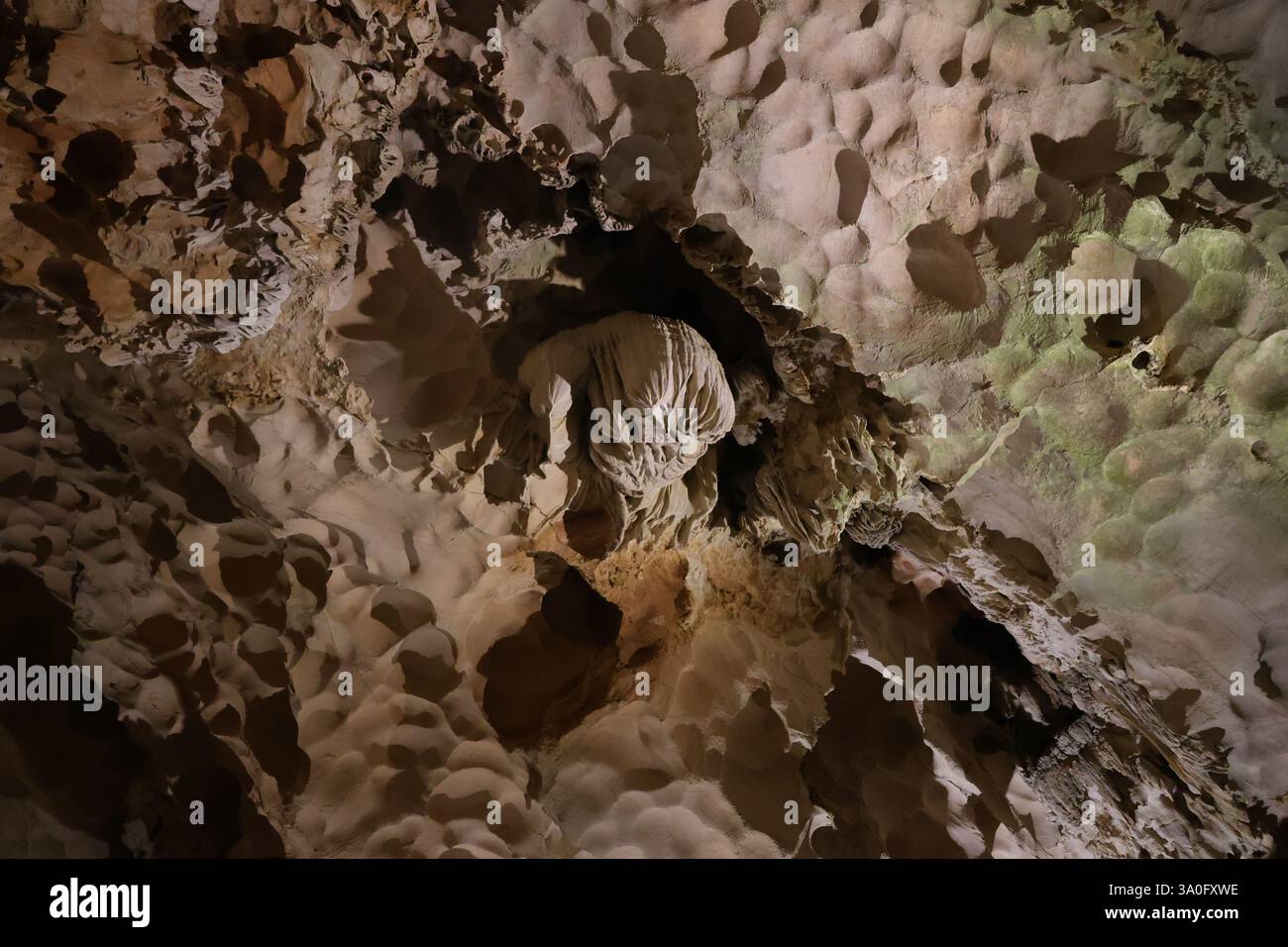 Caves on Islands in Ha Long Bay Stock Photo - Alamy