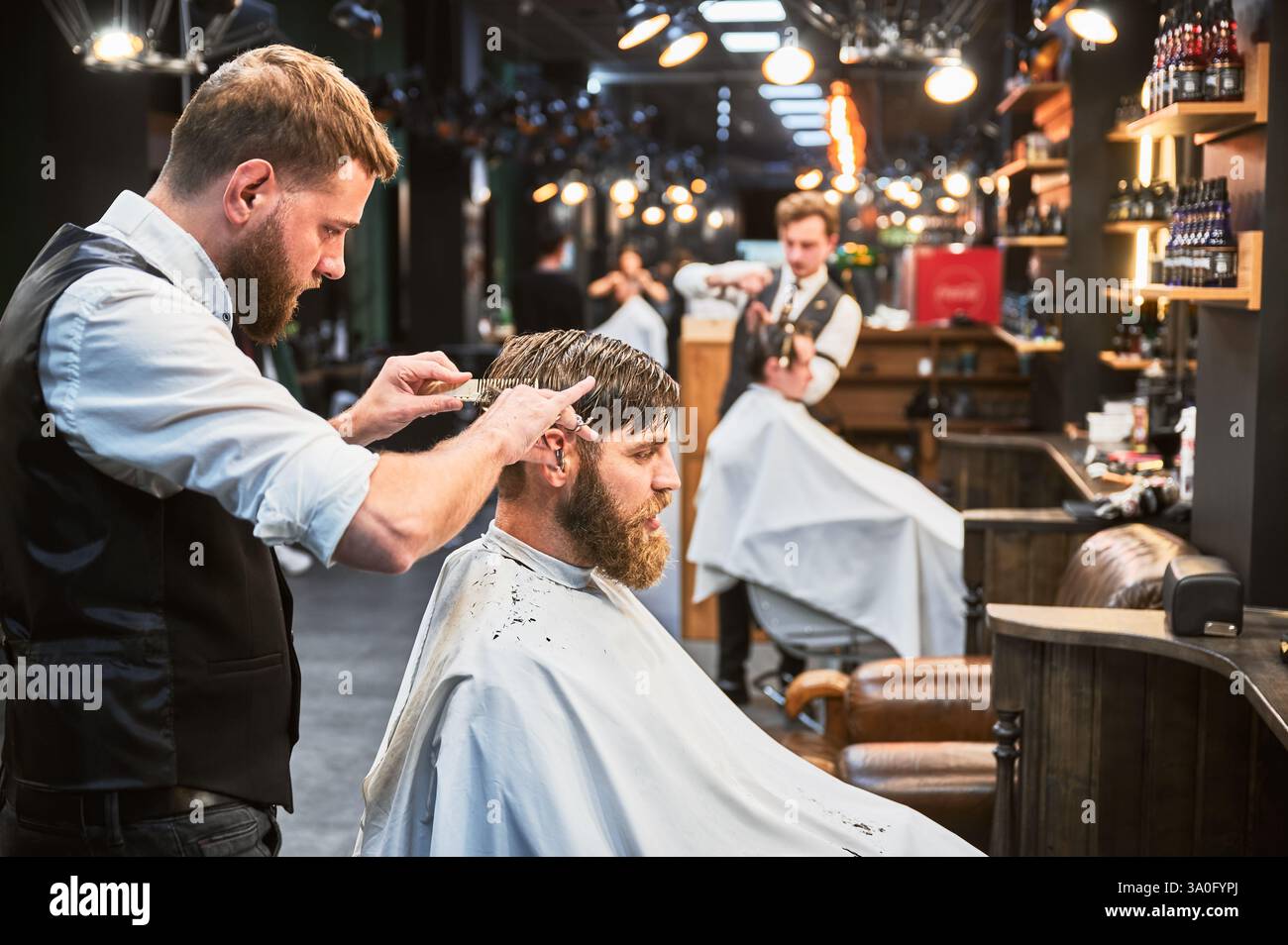 Confident barber in fancy outfit working on stylish haircut. Busy day ...