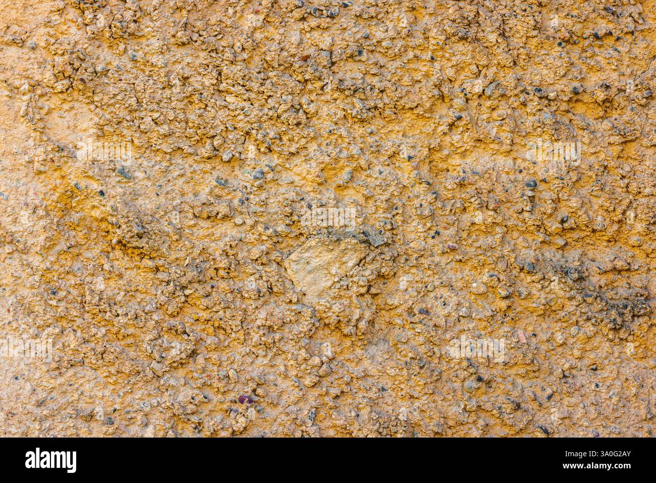 rugged beige concrete wall texture with pebbles Stock Photo - Alamy