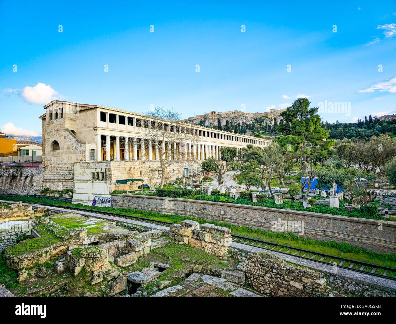 Visitors explore the extensive ruins of the ancient agora in Athens ...