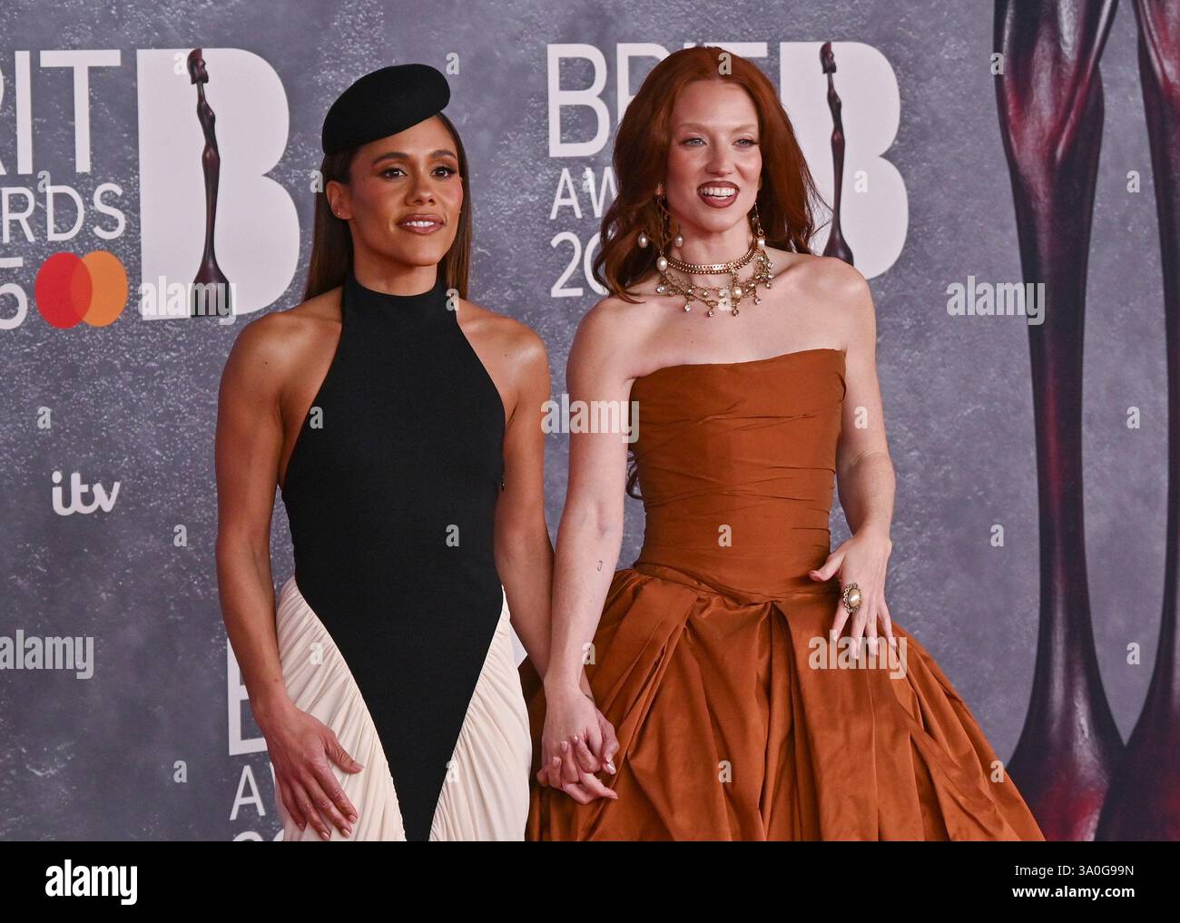 ***STRICTLY EDITORIAL USE ONLY*** Alex Scott and Jess Glynne attends ...