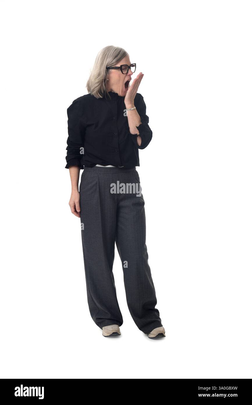 front view of middle aged woman yawning on white background Stock Photo ...